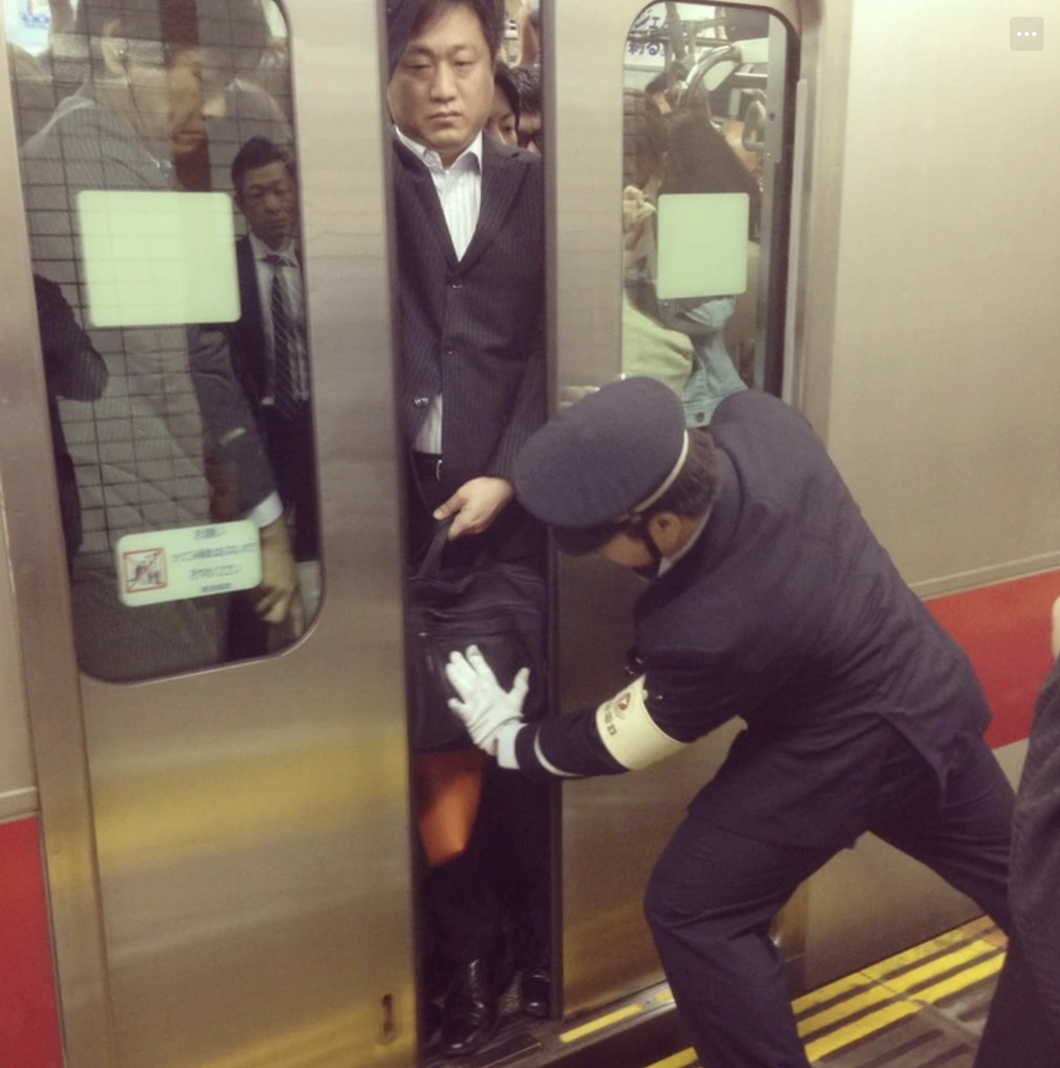 24 Japanese Subway Pushers Who Bring Commuters Closer | eBaum's World