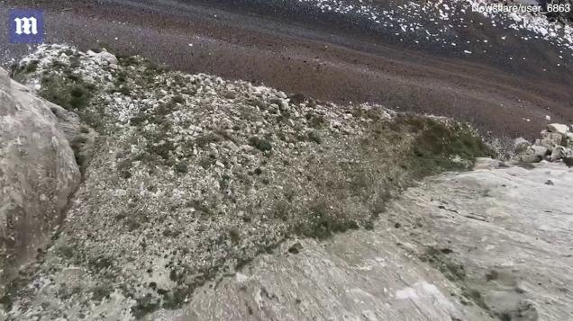 Base Jumper Leaps Off Cliff and Crashes Onto Beach Below! - Wow Video ...